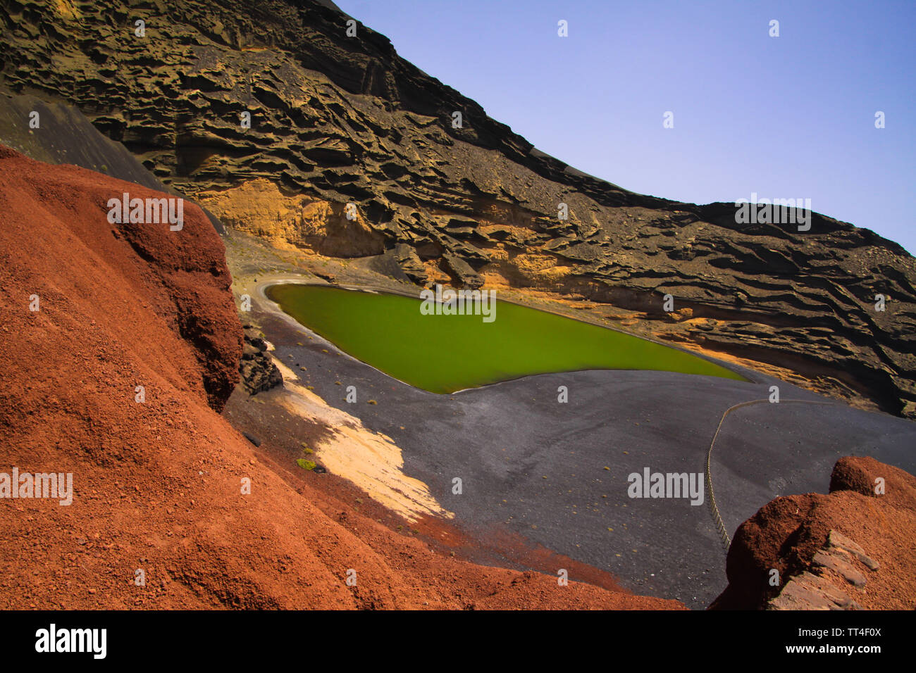 View on secluded deep green lake (Lago verde) in lagoon surrounded by ...
