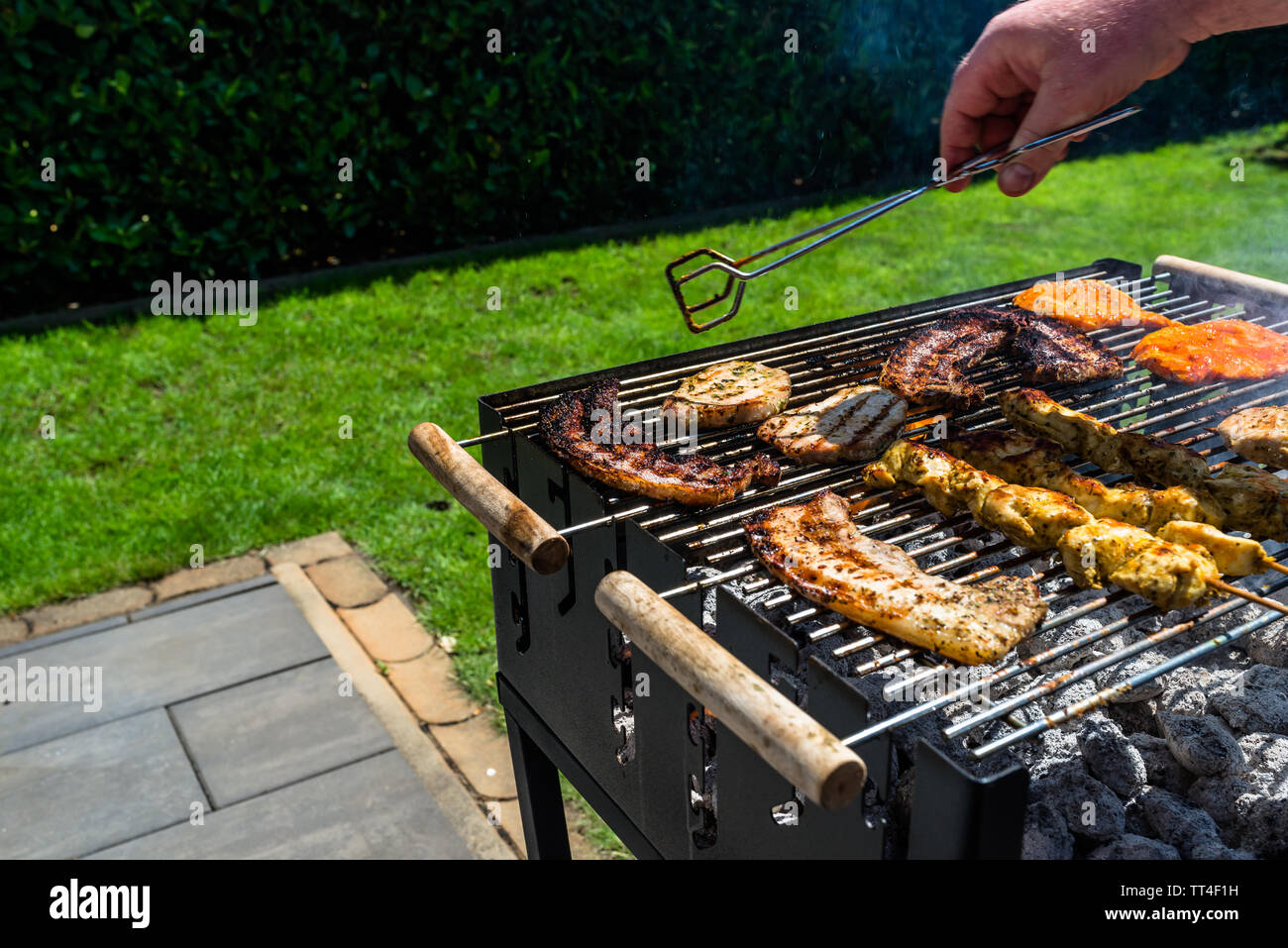 Different types of meat fried on the home grill, standing on a home ...