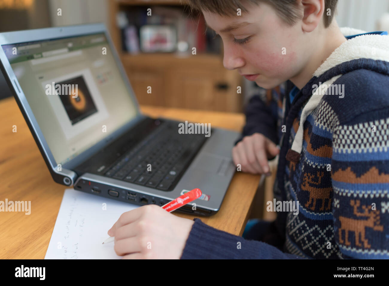 Boy girl doing homework table hi-res stock photography and images - Alamy