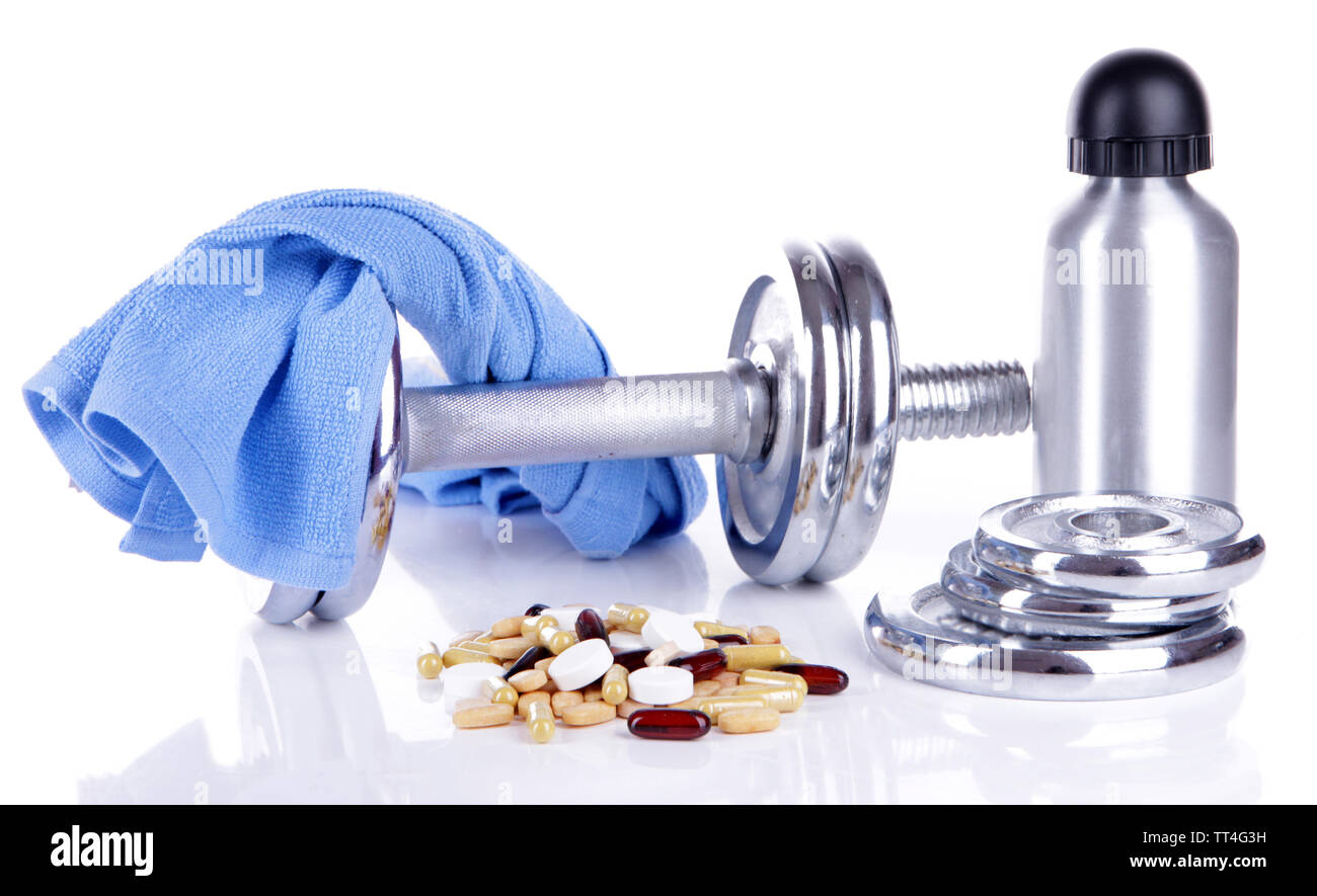 Dumbbell and colorful pills, tablets, isolated on white Stock Photo - Alamy