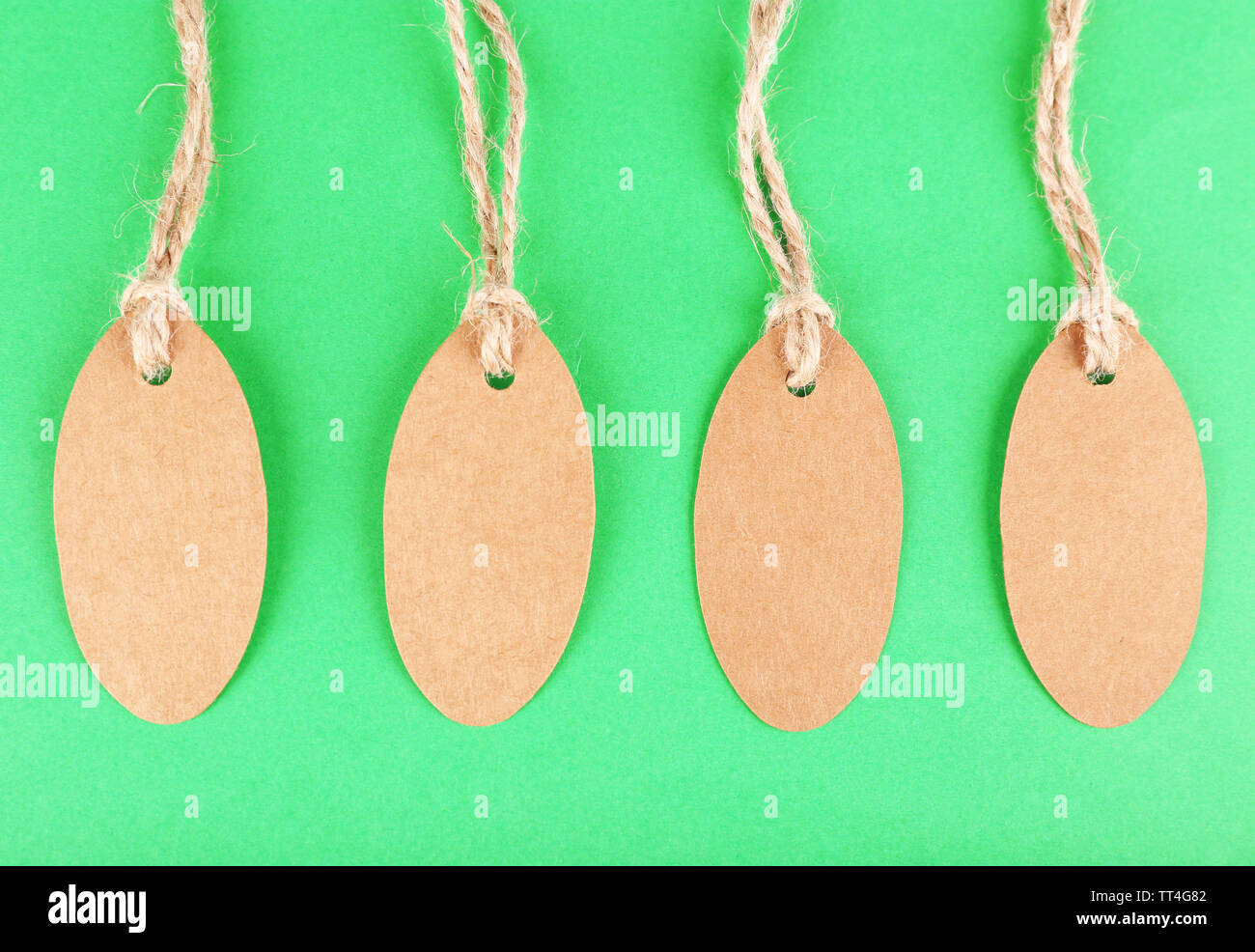Brown tags on colorful background Stock Photo - Alamy