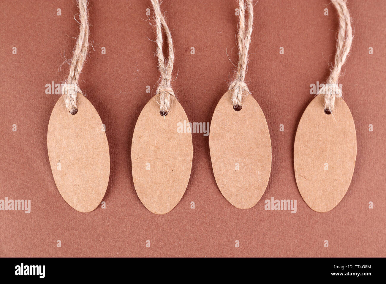Brown tags on colorful background Stock Photo - Alamy