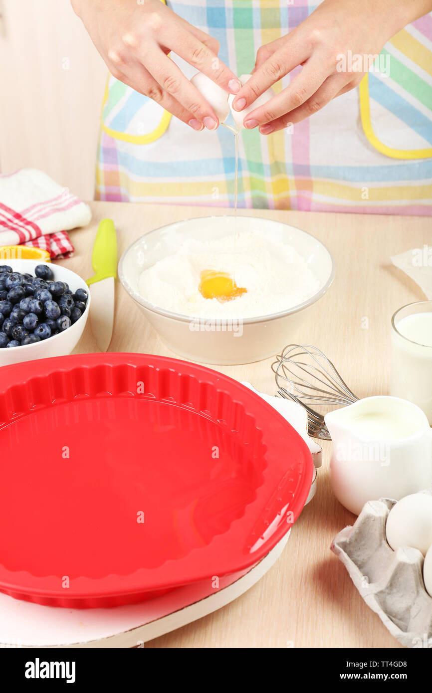 Baking tasty pie and ingredients for it on table in kitchen Stock Photo ...