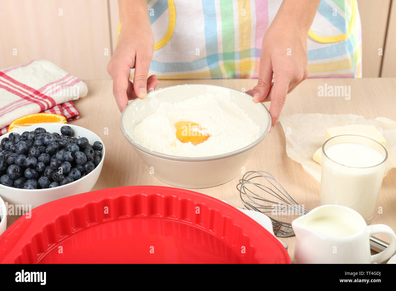 Baking tasty pie and ingredients for it on table in kitchen Stock Photo ...