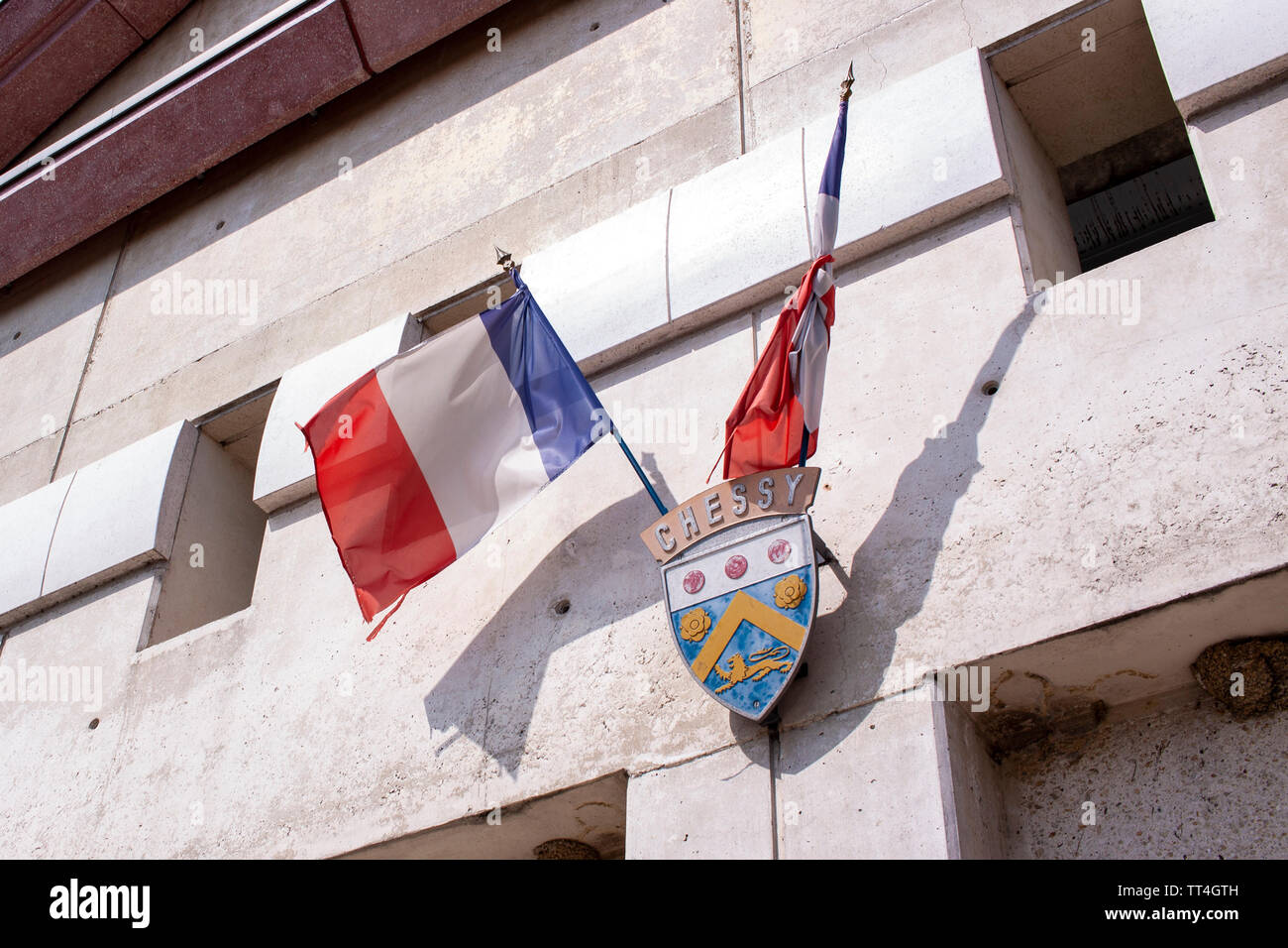 French Tricolor flags fly outside of Gare Marne-La-Vallee Chessy. Lewis ...
