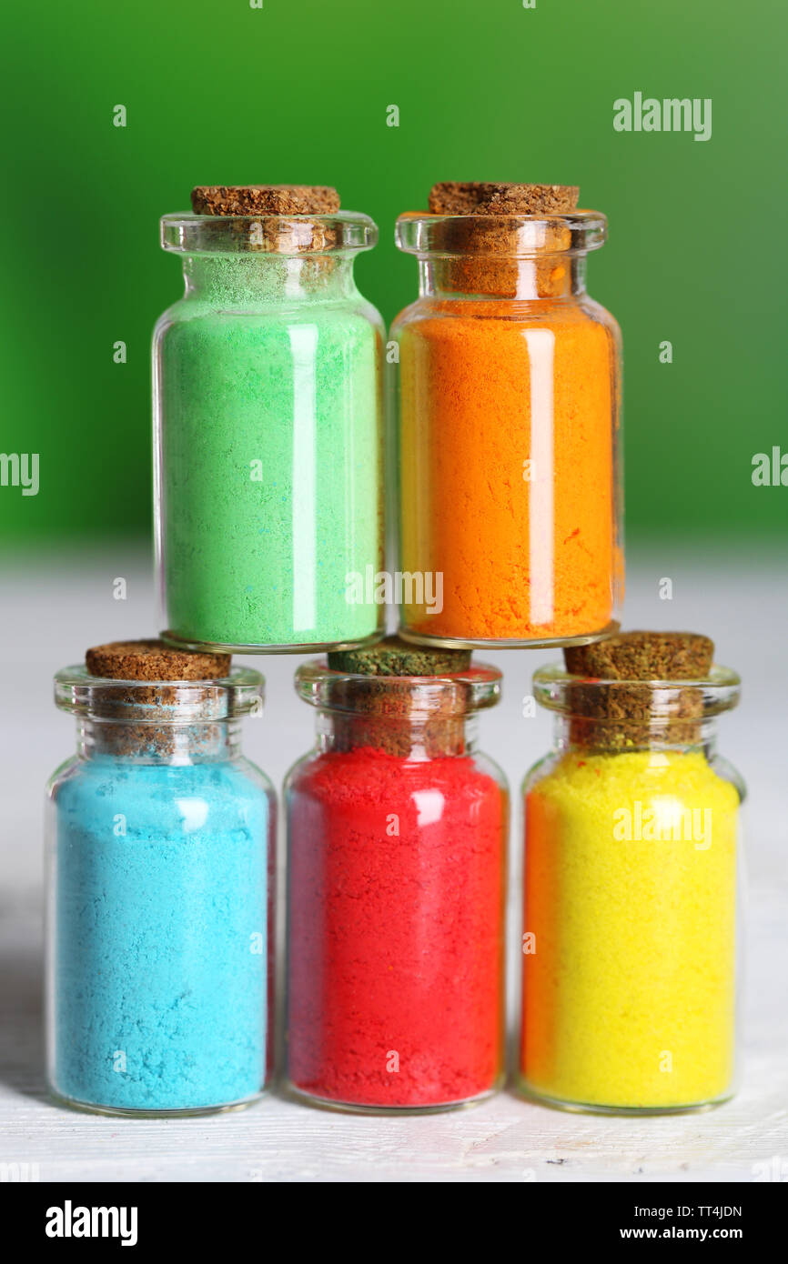 Bottles with colorful dry pigments on bright background Stock Photo - Alamy
