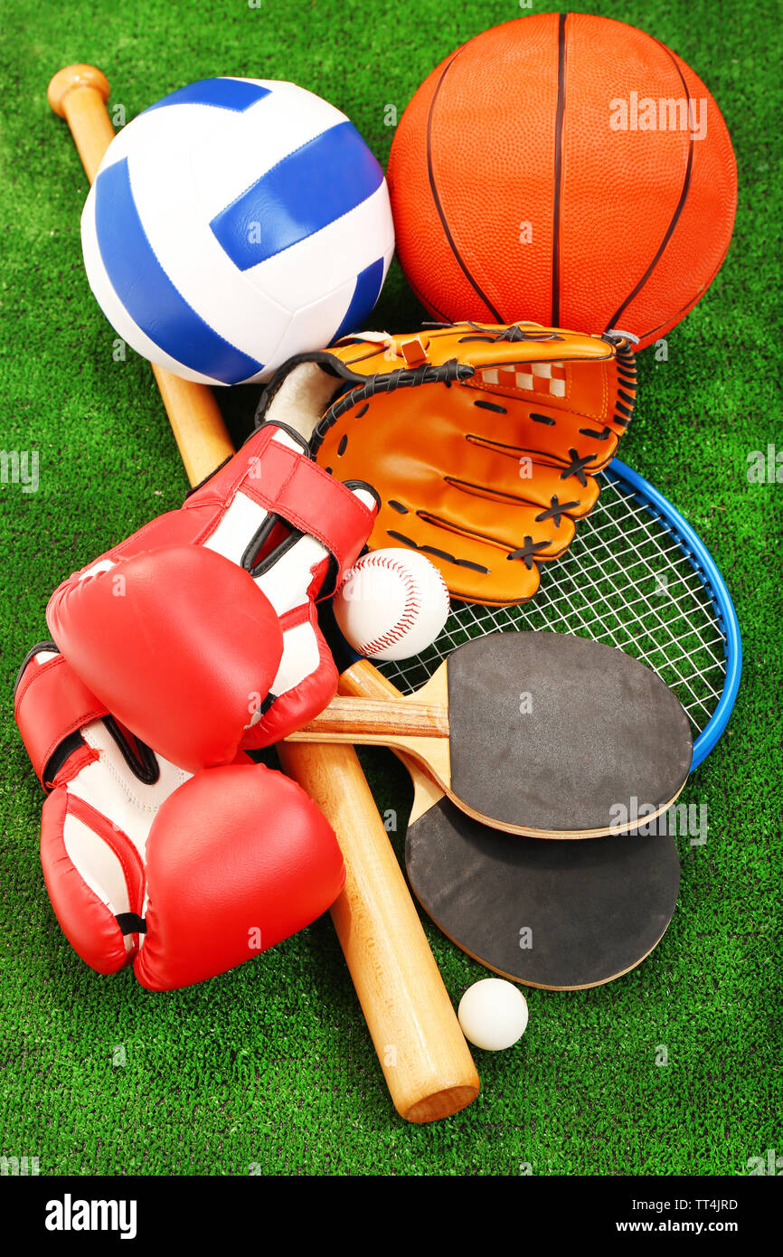 Sports equipment on grass background Stock Photo - Alamy