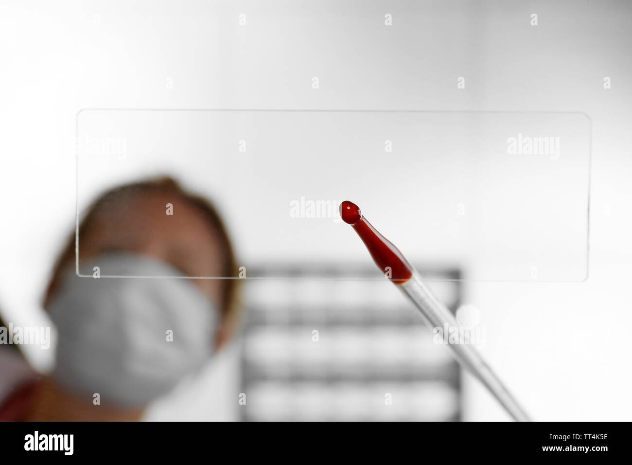Laboratory researcher drop blood sample hi-res stock photography and ...