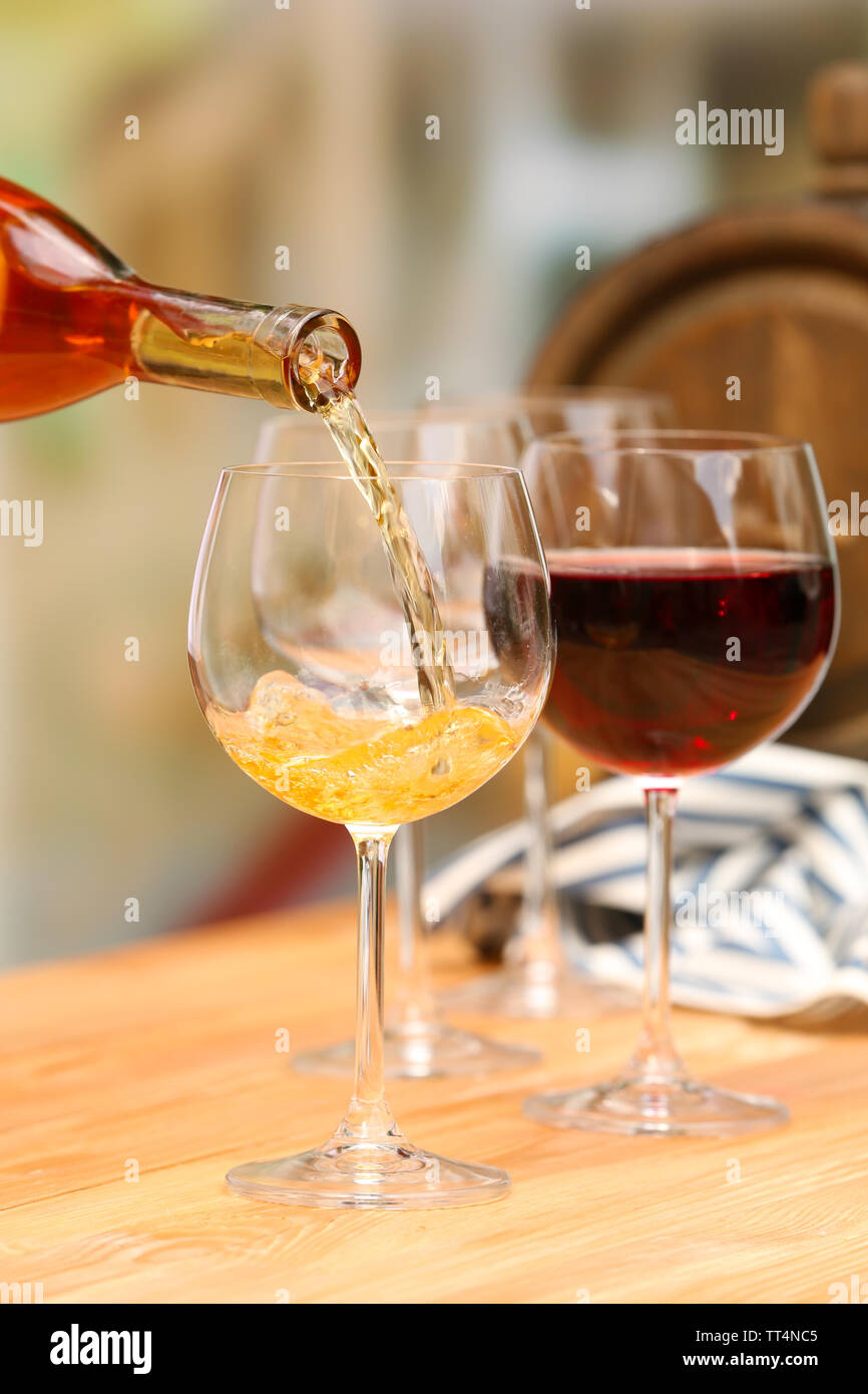 Wine pouring into wine glass, close-up Stock Photo - Alamy