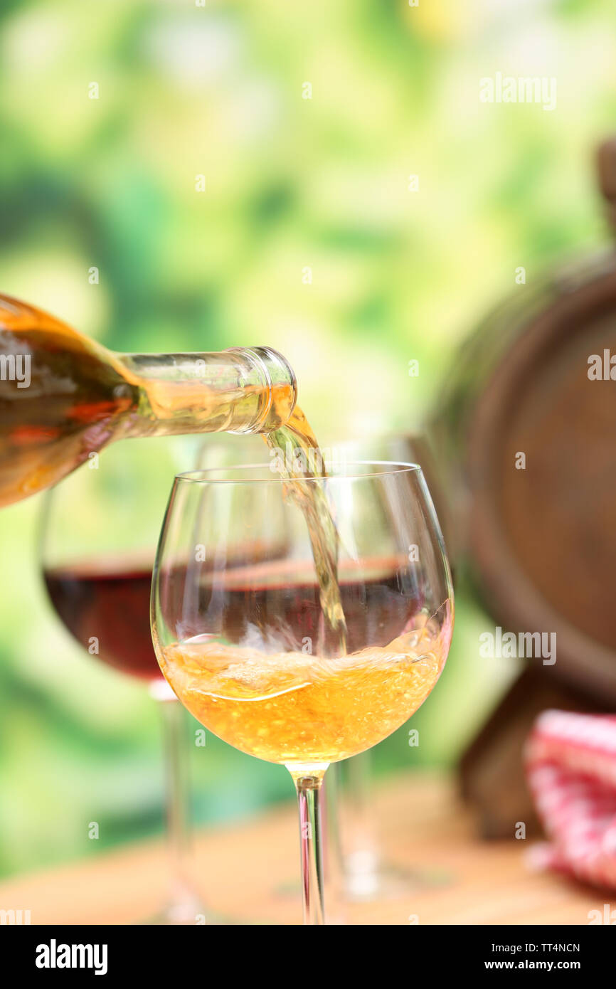 Wine pouring into wine glass, close-up Stock Photo - Alamy