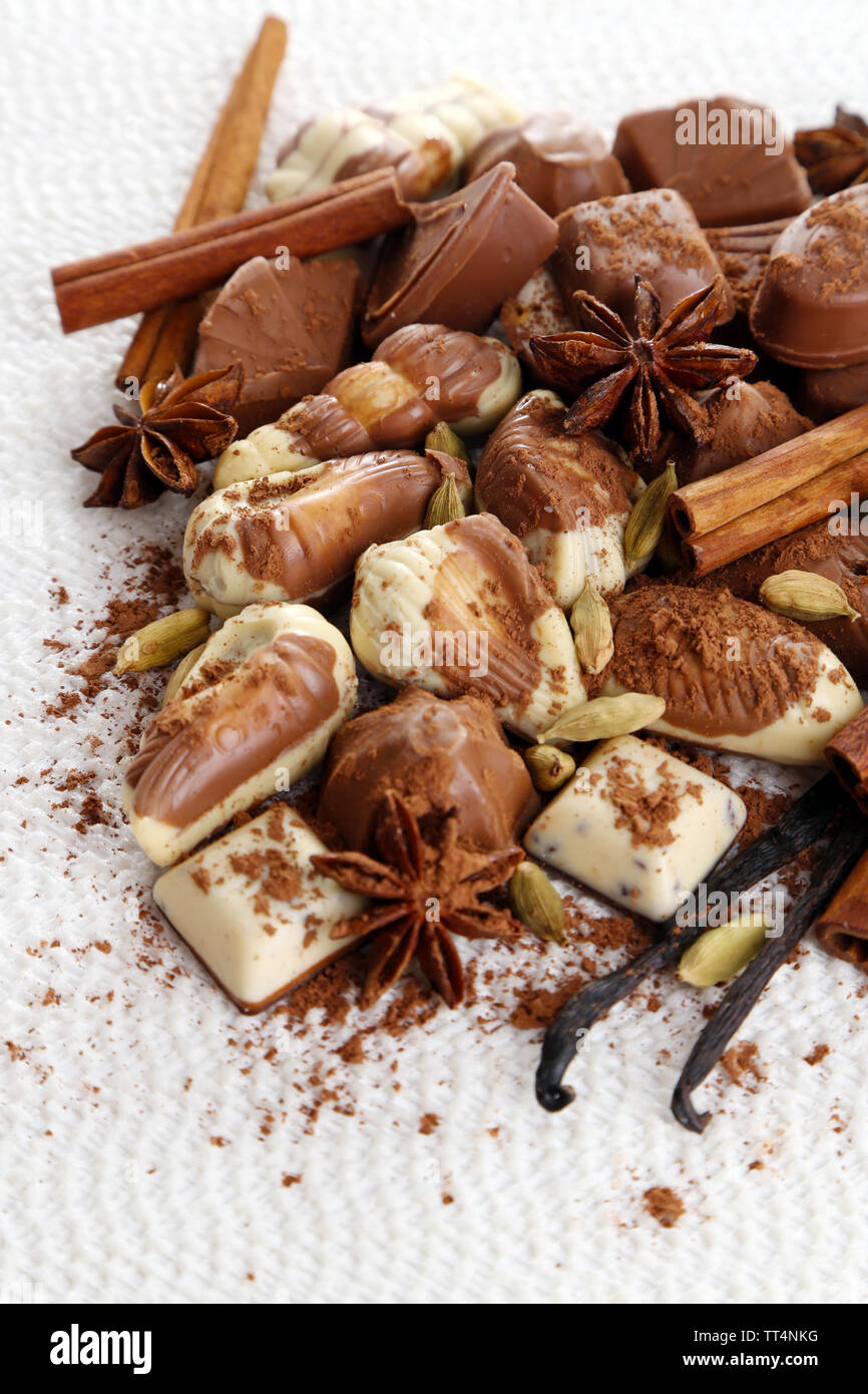 Different kinds of chocolates with spices on white background Stock ...