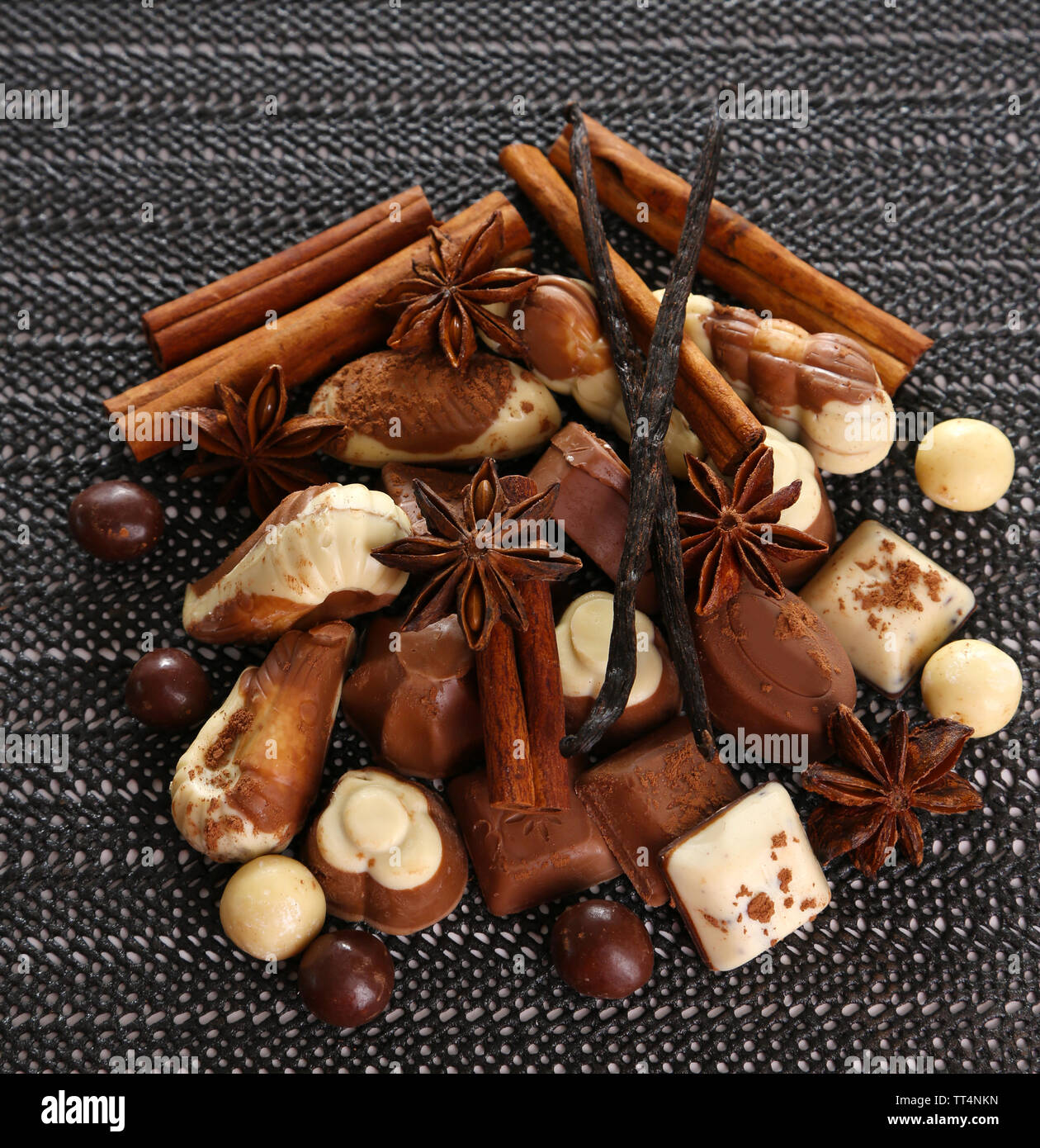 Different kinds of chocolates with spices on dark background Stock ...