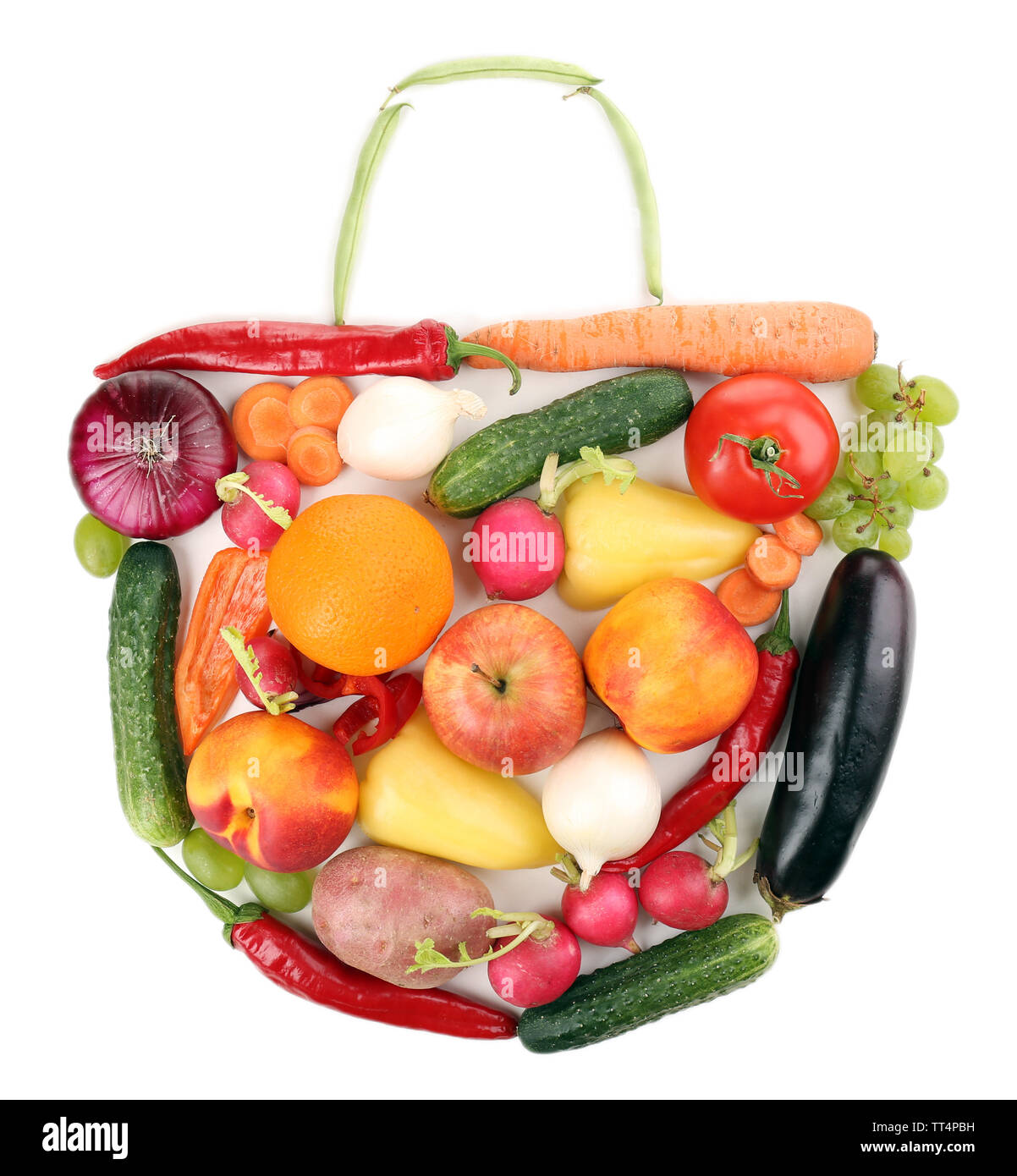 Fresh organic vegetables and fruits in shape of bag, isolated on white ...
