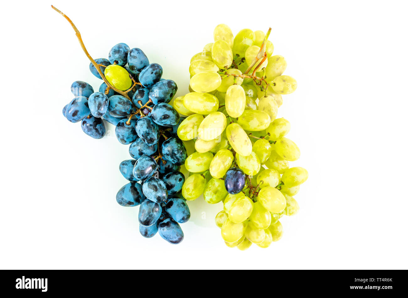 Two varieties of grapes on white background Stock Photo - Alamy