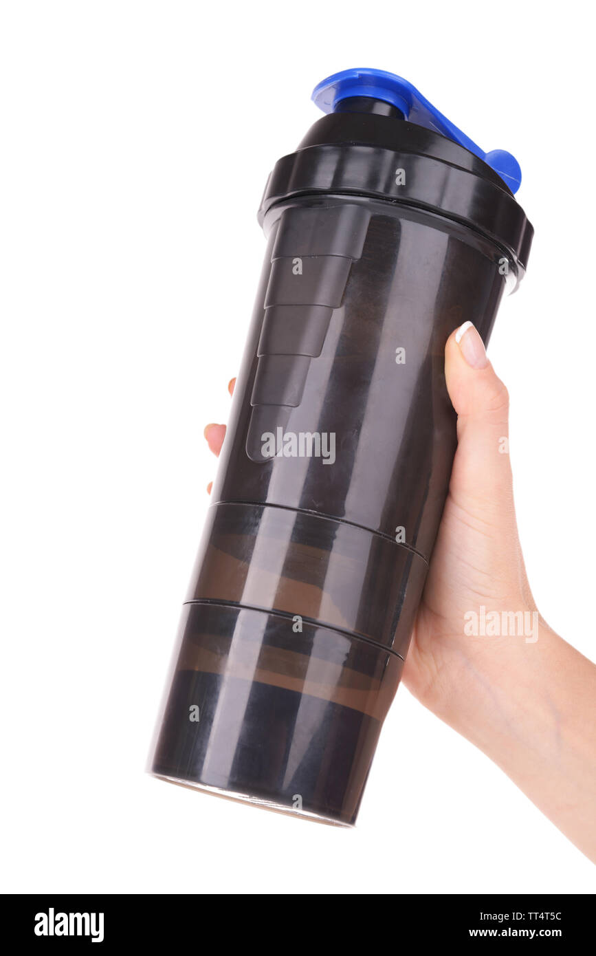 Female hand holding plastic shaker with protein shake isolated on white ...
