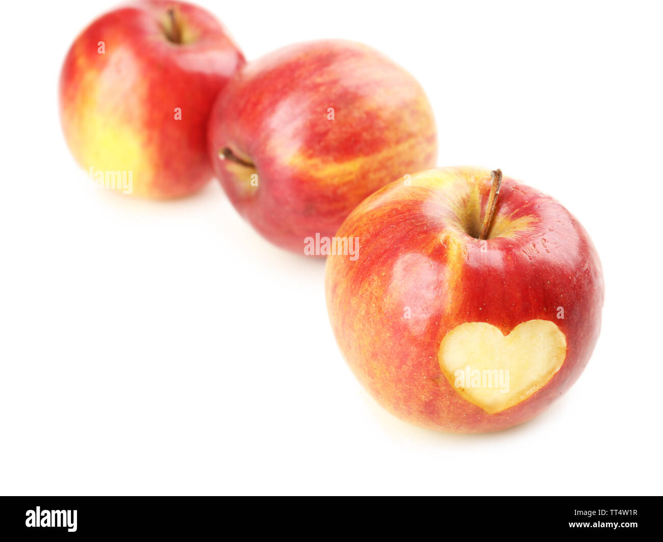 Red apple with heart isolated on white Stock Photo - Alamy