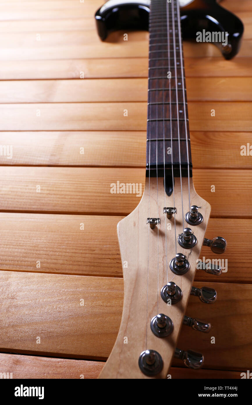 Guitar fretboard on wooden background Stock Photo - Alamy