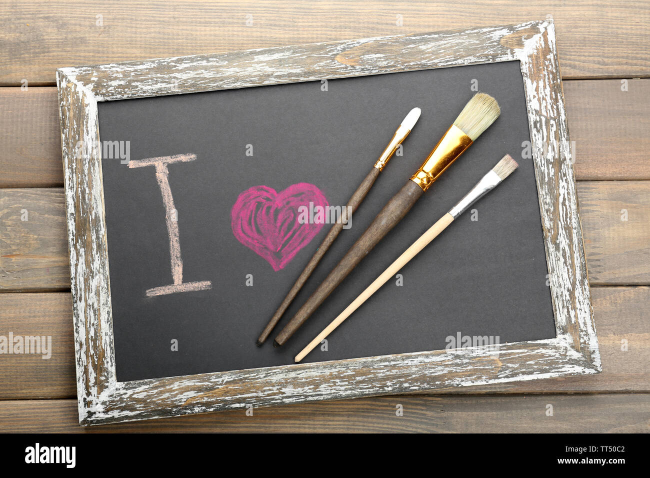 I love painting written on chalkboard, close-up Stock Photo - Alamy