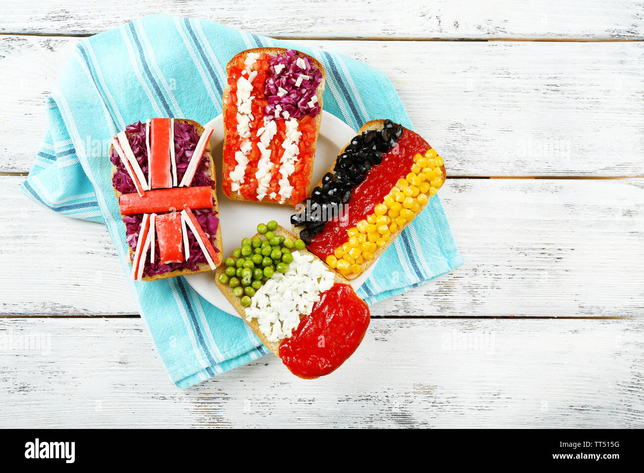 Sandwiches with different flags on table close-up Stock Photo - Alamy