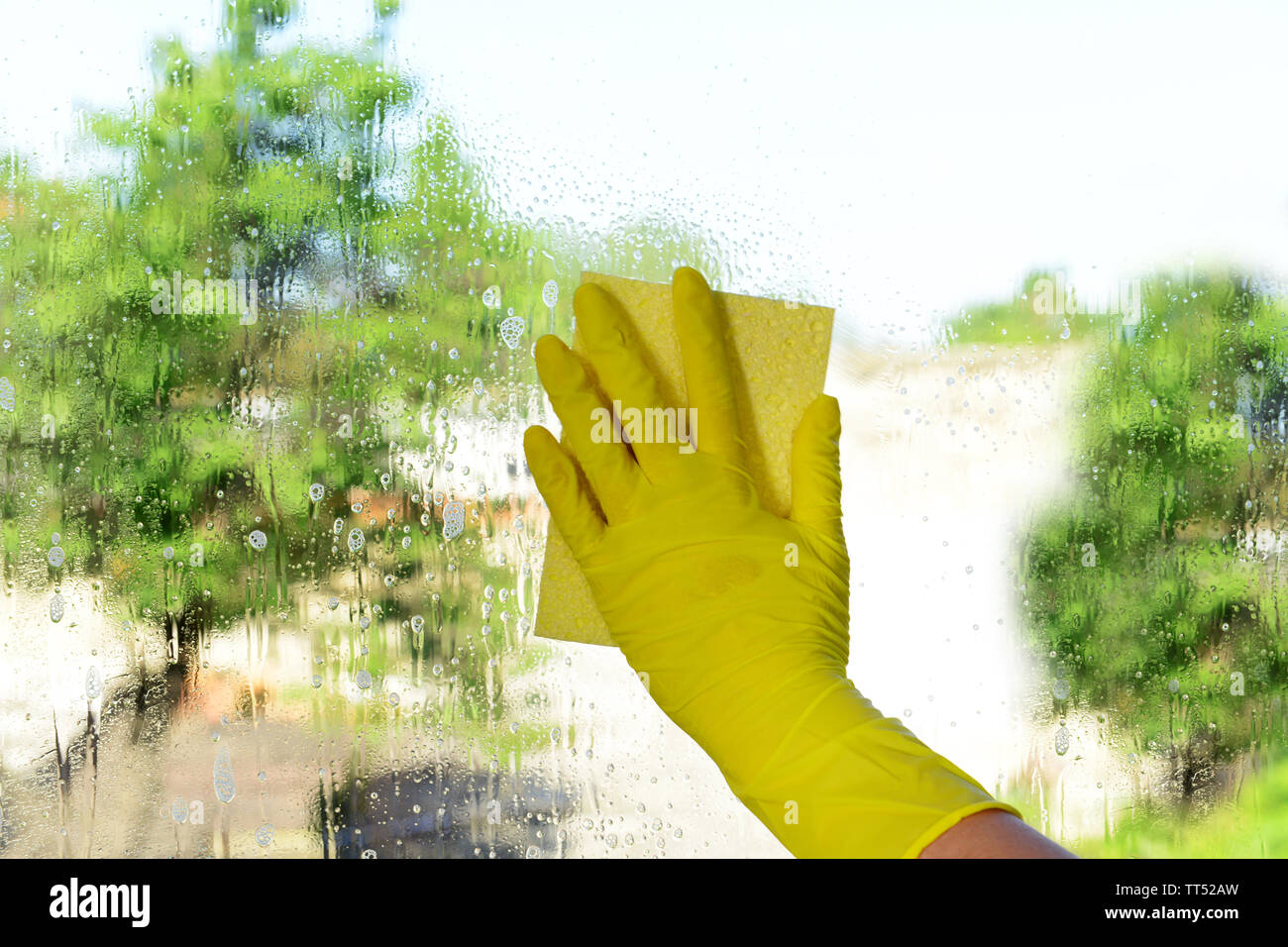 Cleaning windows with special rag Stock Photo - Alamy