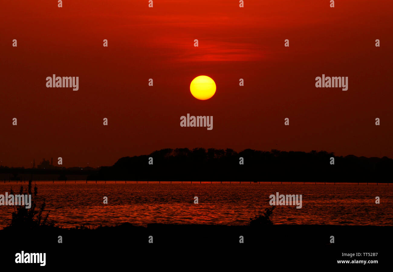 sun set in village landscape view with lake Stock Photo - Alamy