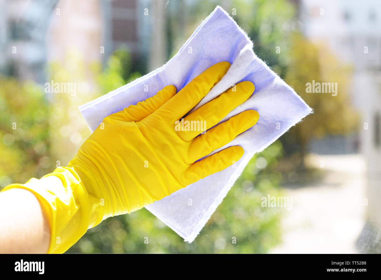Cleaning windows with special rag Stock Photo - Alamy