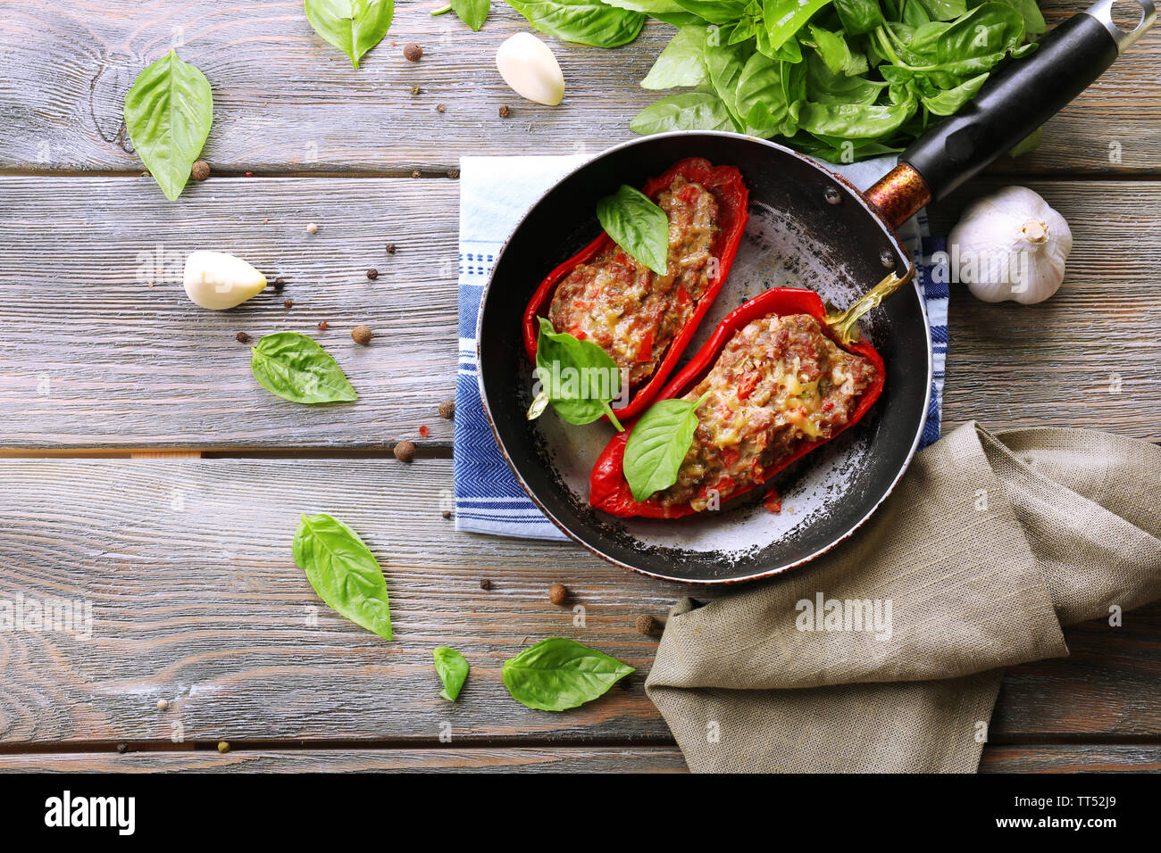 Delicious stuffed peppers in frying pan on table close-up Stock Photo ...