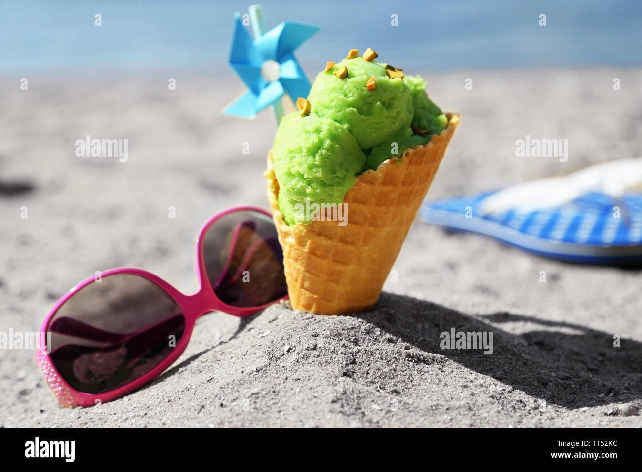 Ice cream in sand on beach Stock Photo - Alamy