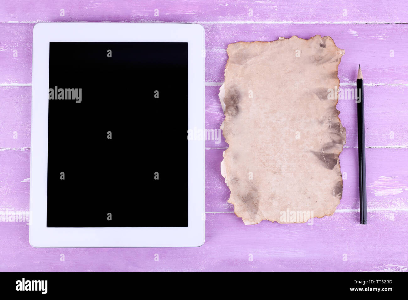 Tablet, piece of paper and pencil on wooden background Stock Photo - Alamy