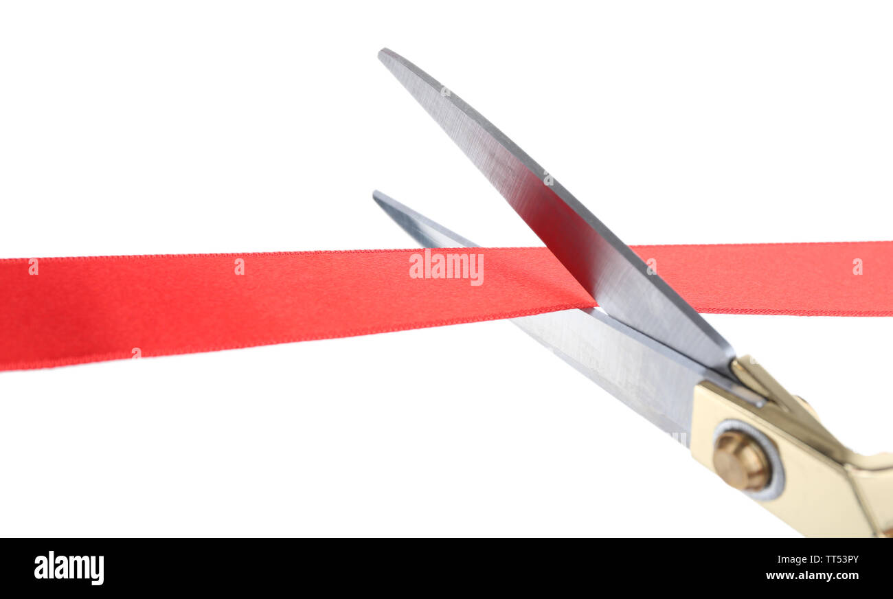 Scissors cutting red ribbon isolated on white Stock Photo - Alamy