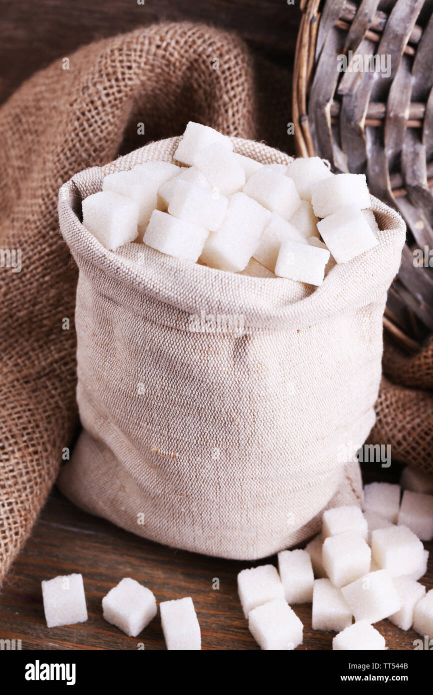 Refined sugar in bag and bowl on wooden background Stock Photo - Alamy