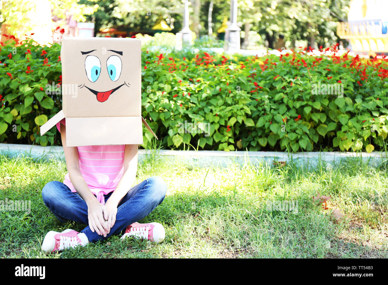 Woman with cardboard box on her head with happy face, outdoors Stock ...