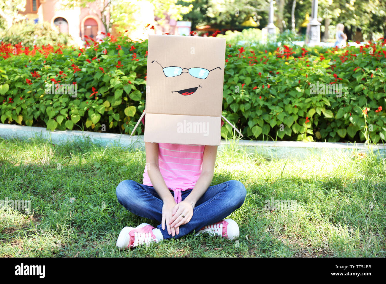 Woman with cardboard box on her head with happy face, outdoors Stock ...