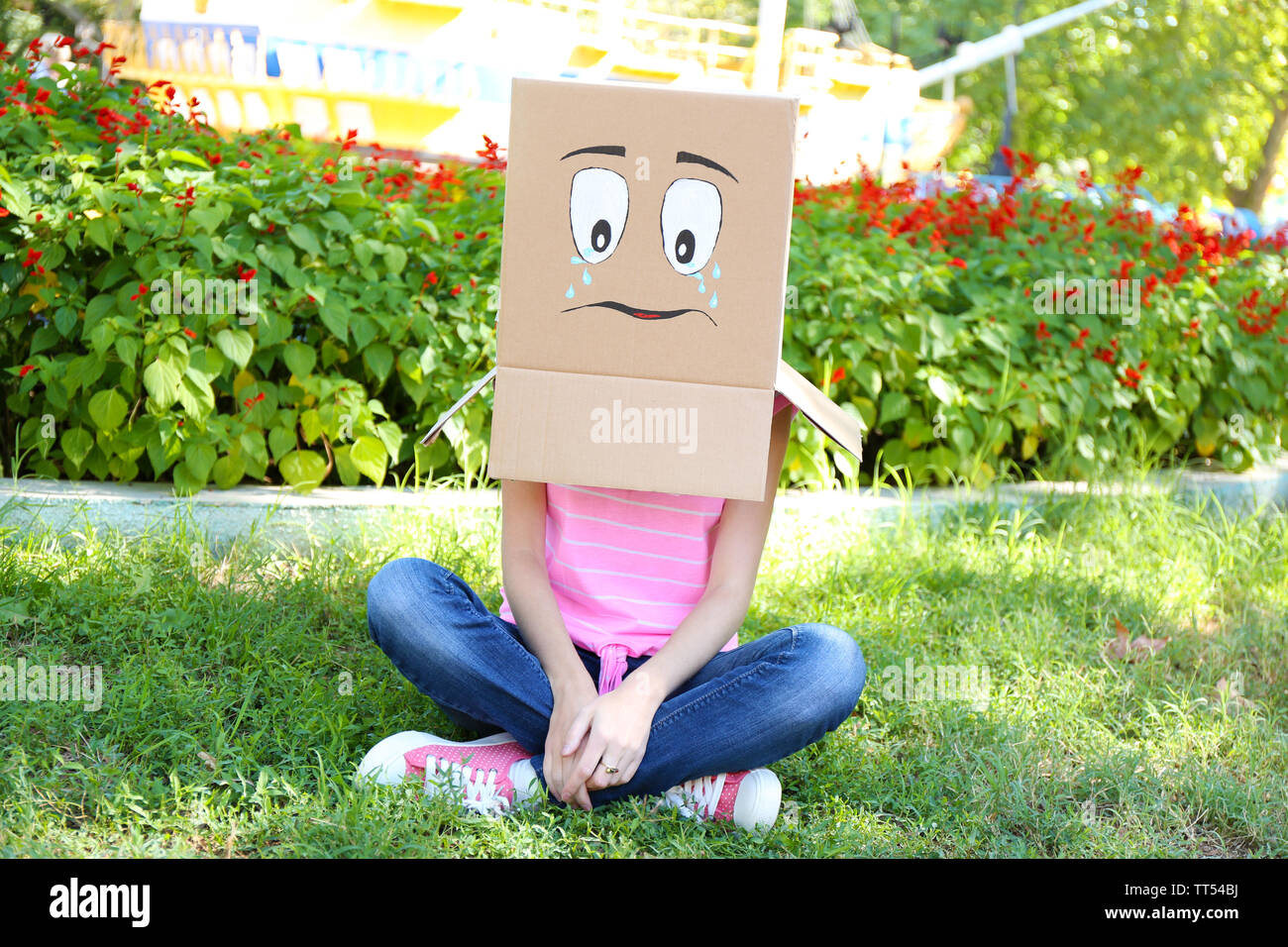 Woman with cardboard box on her head with sad face, outdoors Stock ...