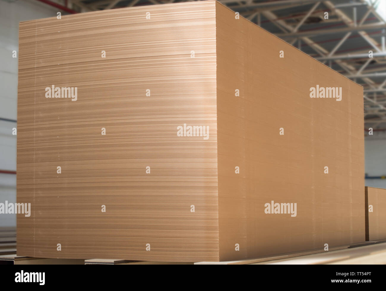 Big stack of MDF boards. Medium Density Fibreboard. Selective focus ...