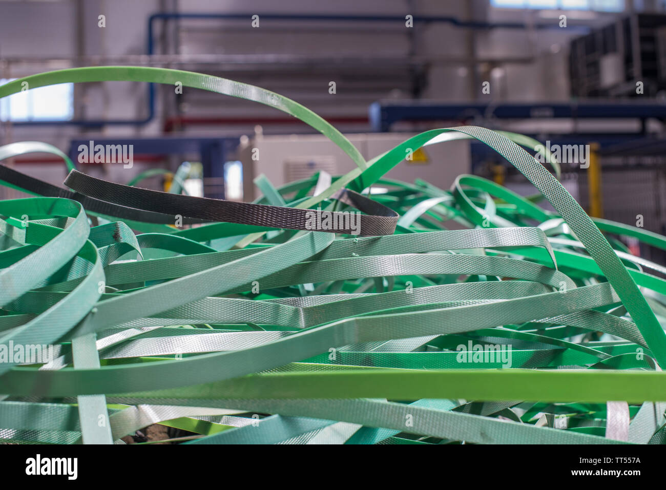Waste plastic ribbon from automated packaging line Stock Photo - Alamy