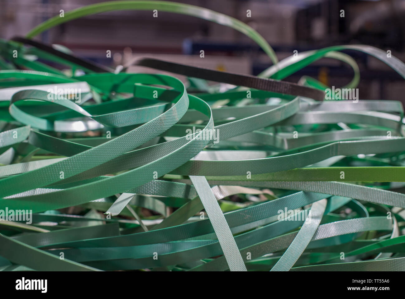 Waste plastic ribbon from automated packaging line Stock Photo - Alamy