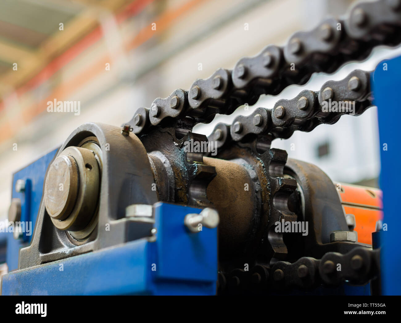 The mechanism of the chain transmission. Bearing, drive shaft, gear and ...