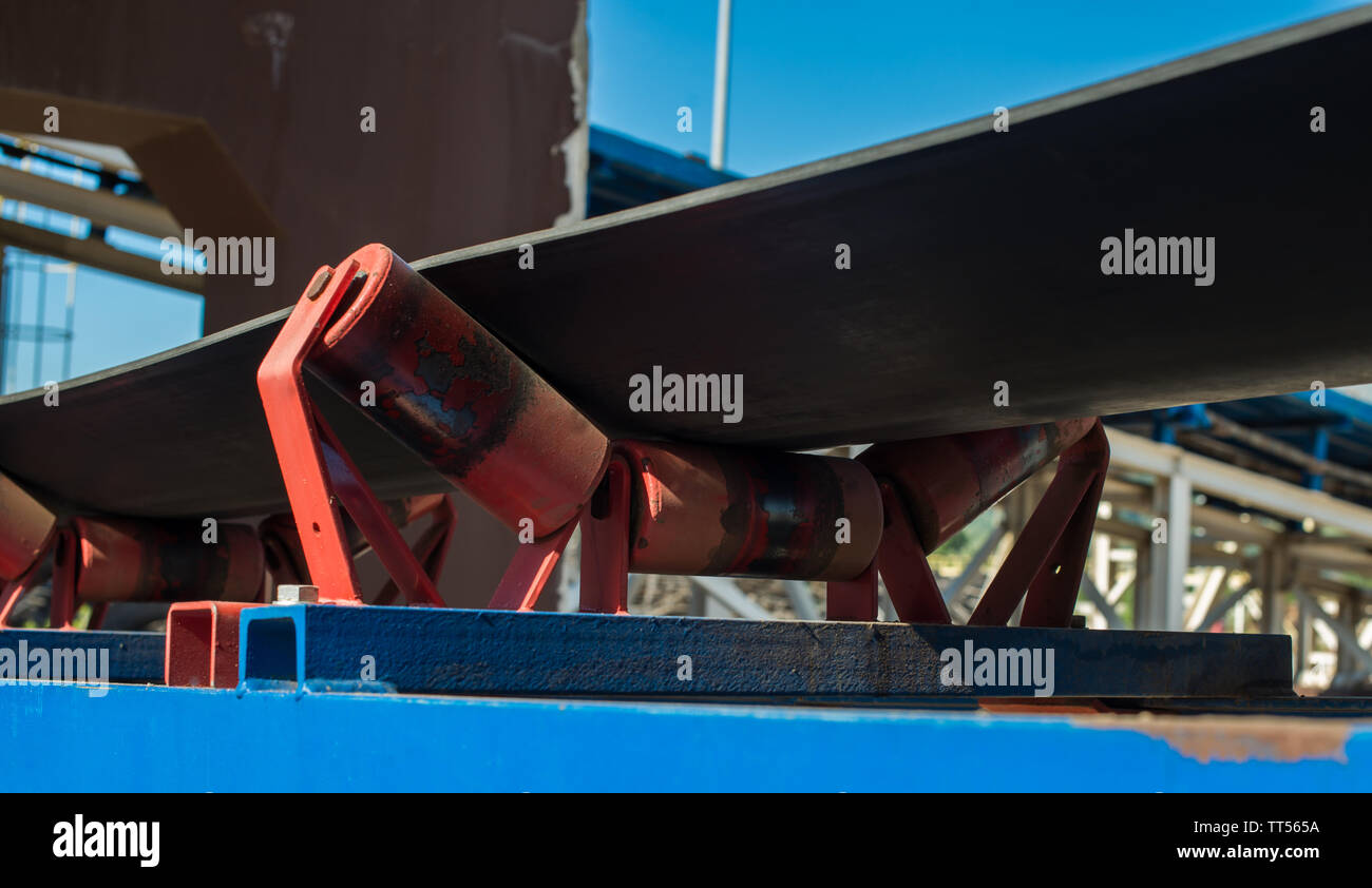 Troughed belt conveyor and its support rollers Stock Photo - Alamy