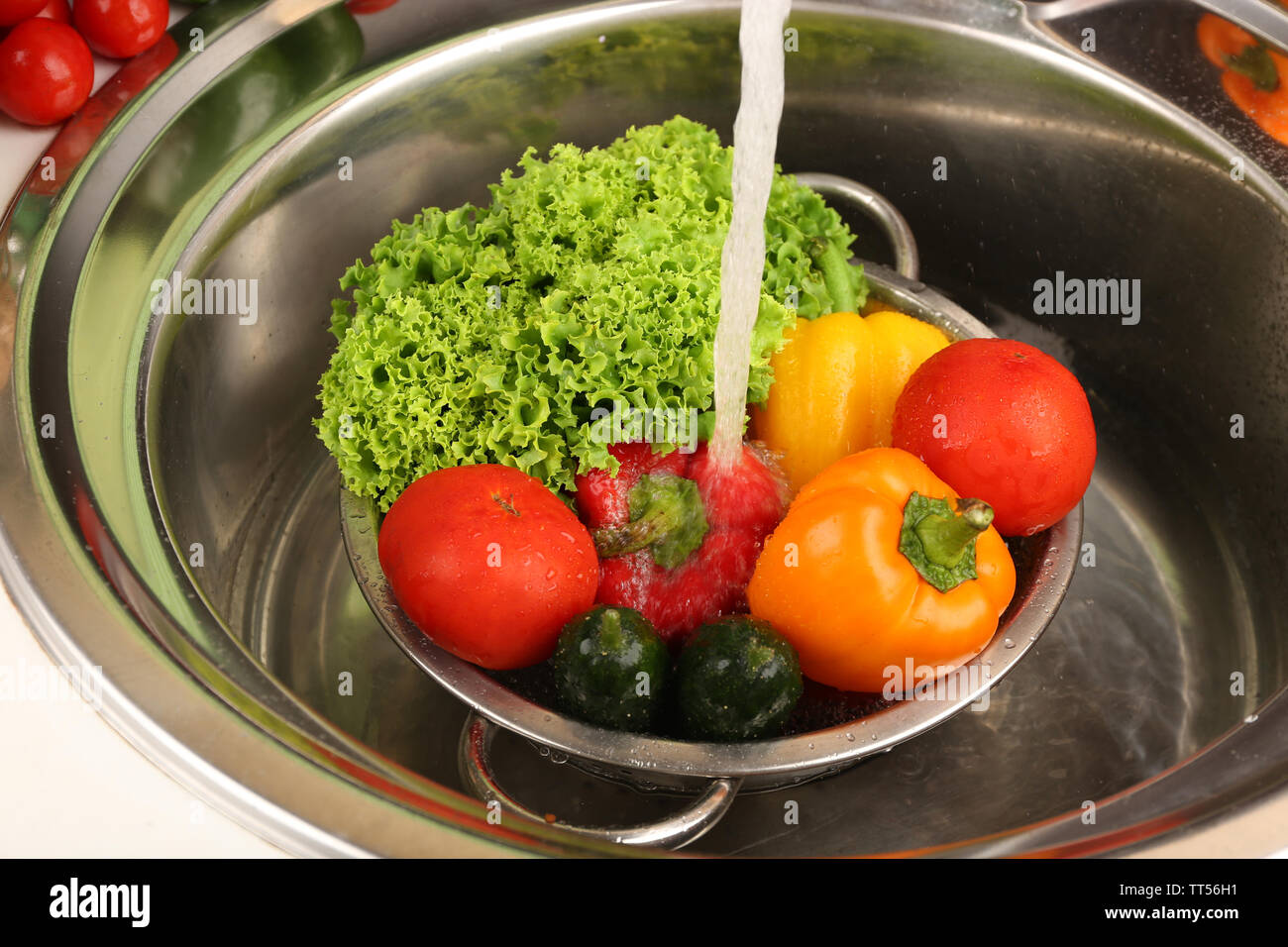 Fresh vegetables in sink in kitchen Stock Photo - Alamy