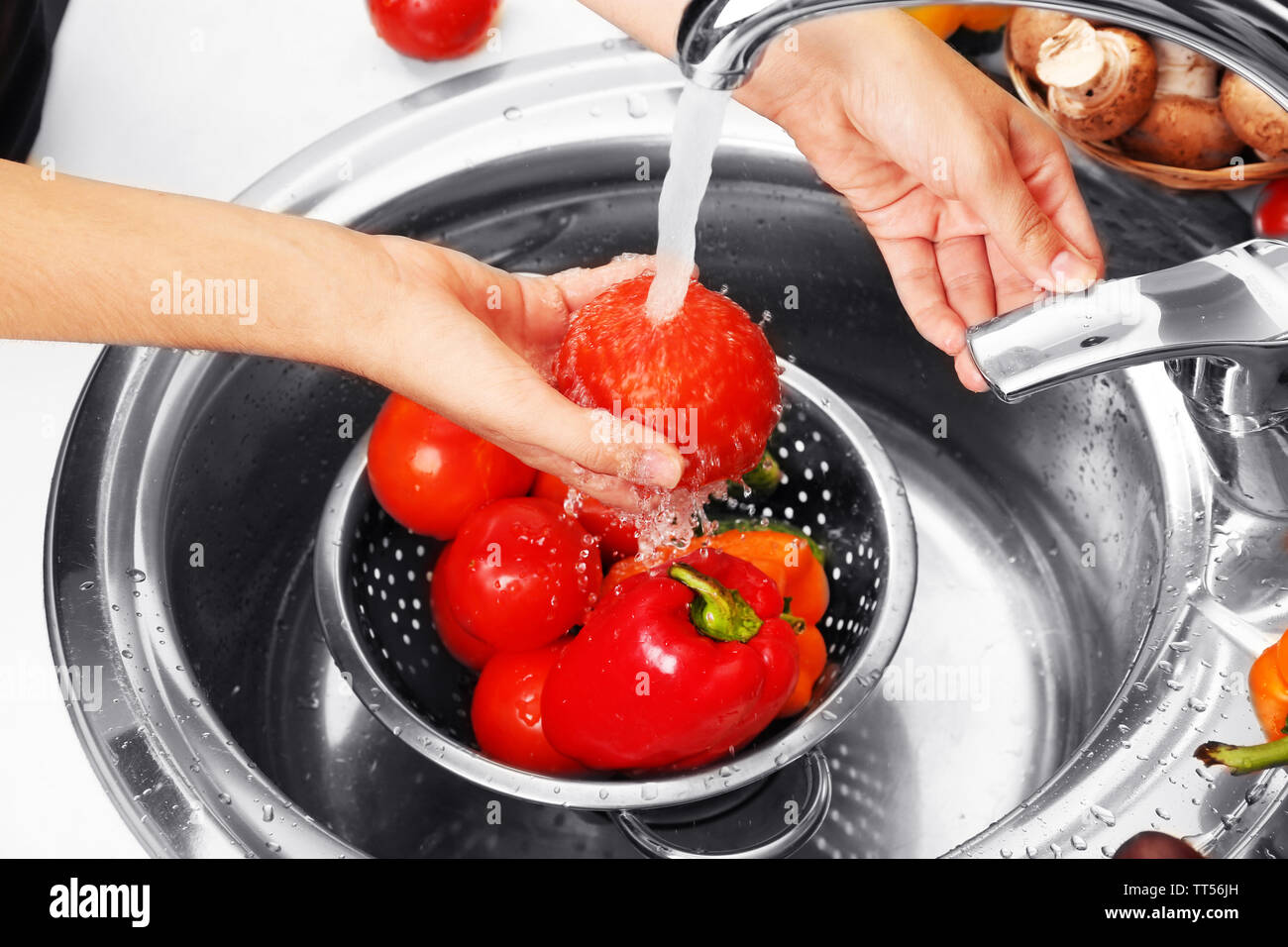 Woman's hands washing vegetables in sink in kitchen Stock Photo - Alamy
