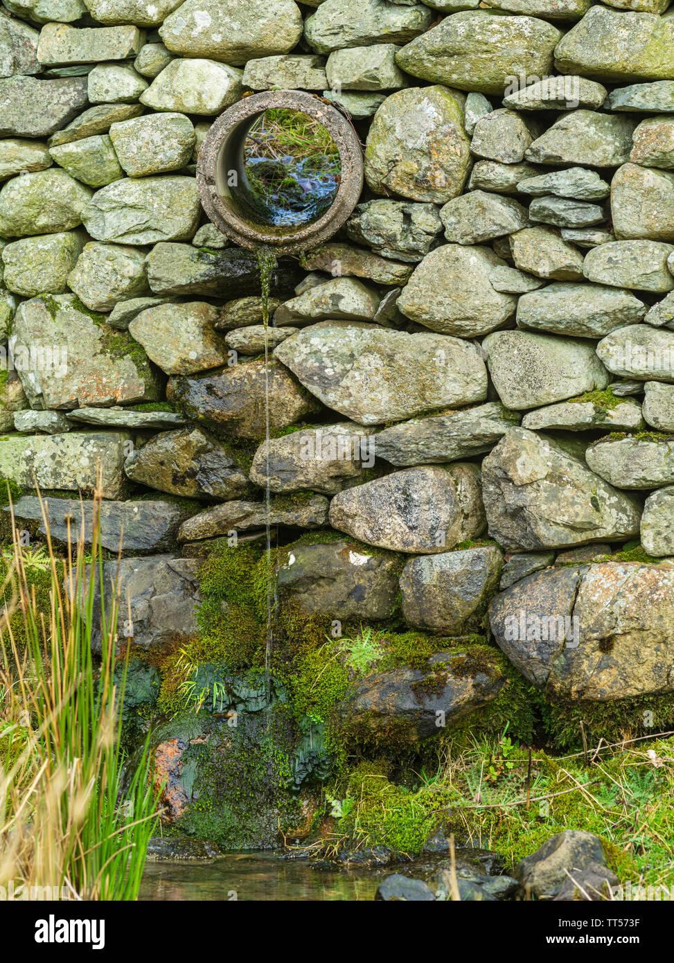 Stone wall with drainage pipe hi-res stock photography and images - Alamy