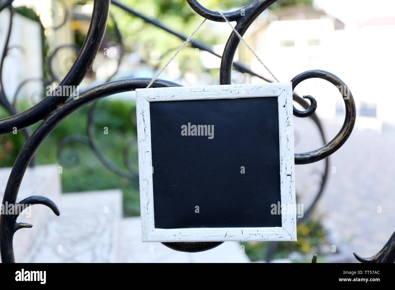 Signboard hanging on metal fence Stock Photo - Alamy