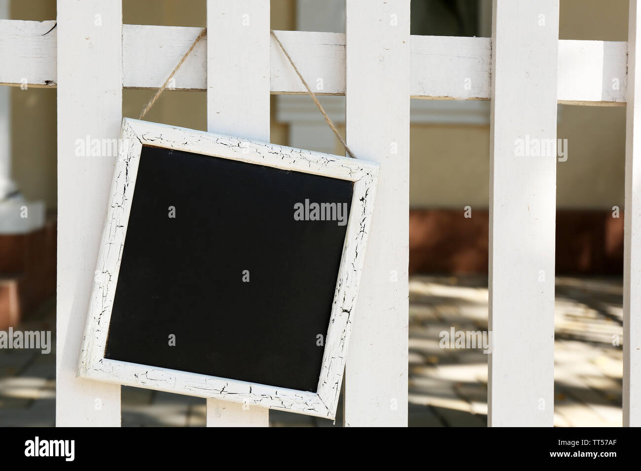 Signboard hanging on wooden fence Stock Photo - Alamy