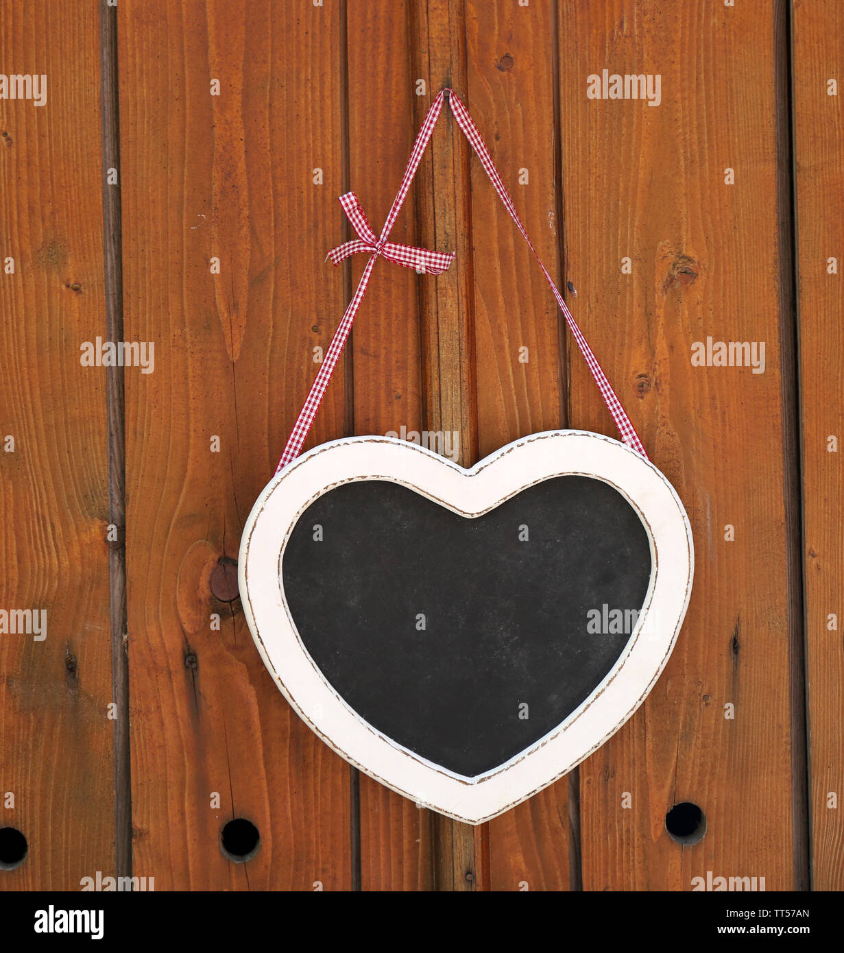 Signboard hanging on wooden fence Stock Photo - Alamy