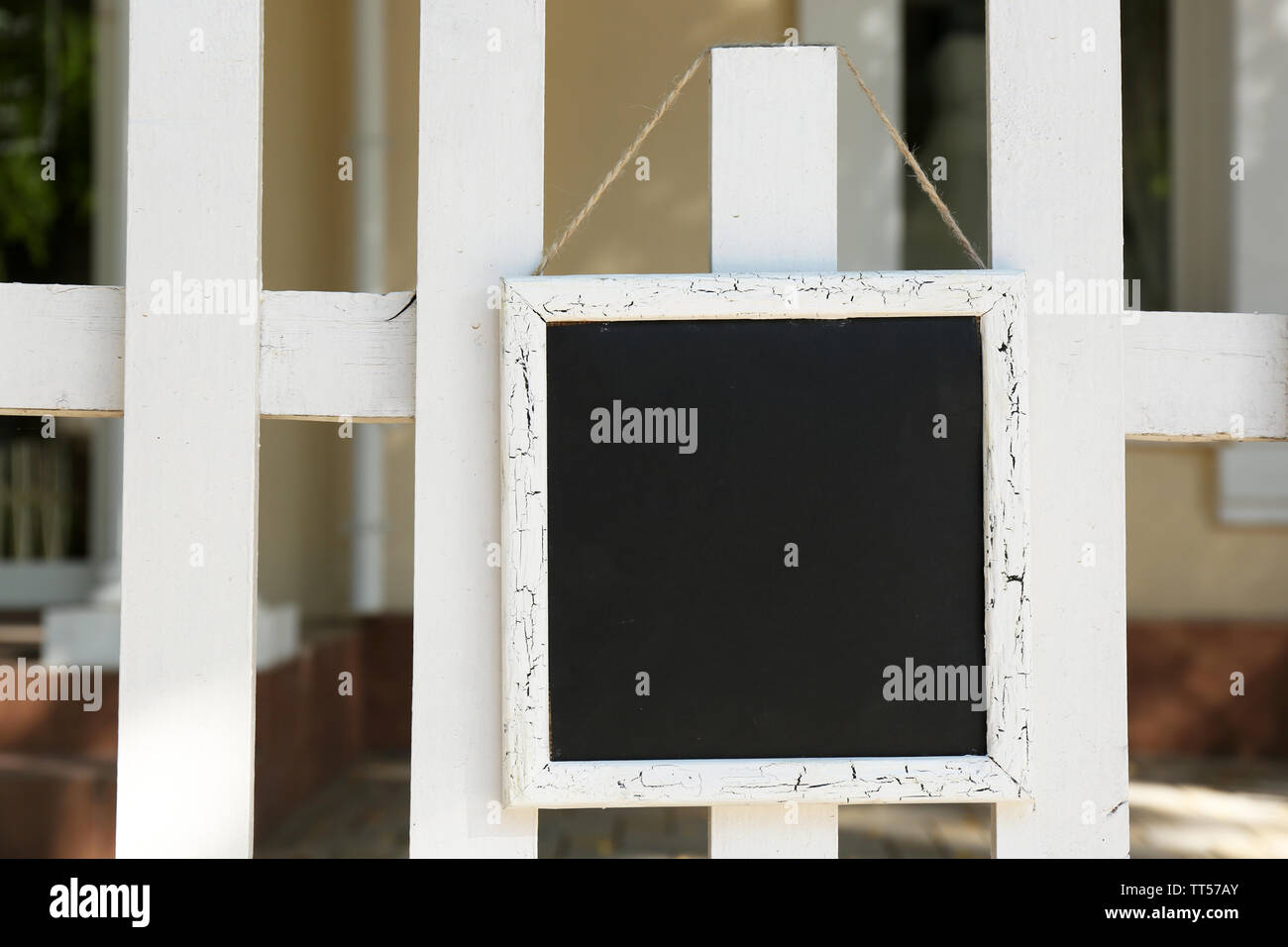 Signboard hanging on wooden fence Stock Photo - Alamy