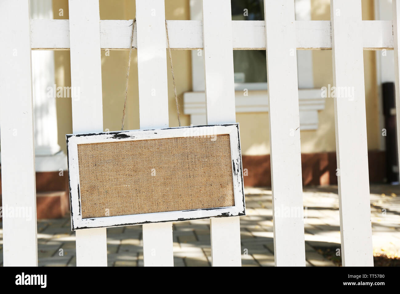 Signboard hanging on wooden fence Stock Photo - Alamy