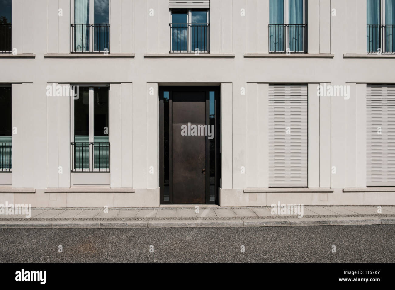 entrance door on modern building with empty street - house door Stock ...