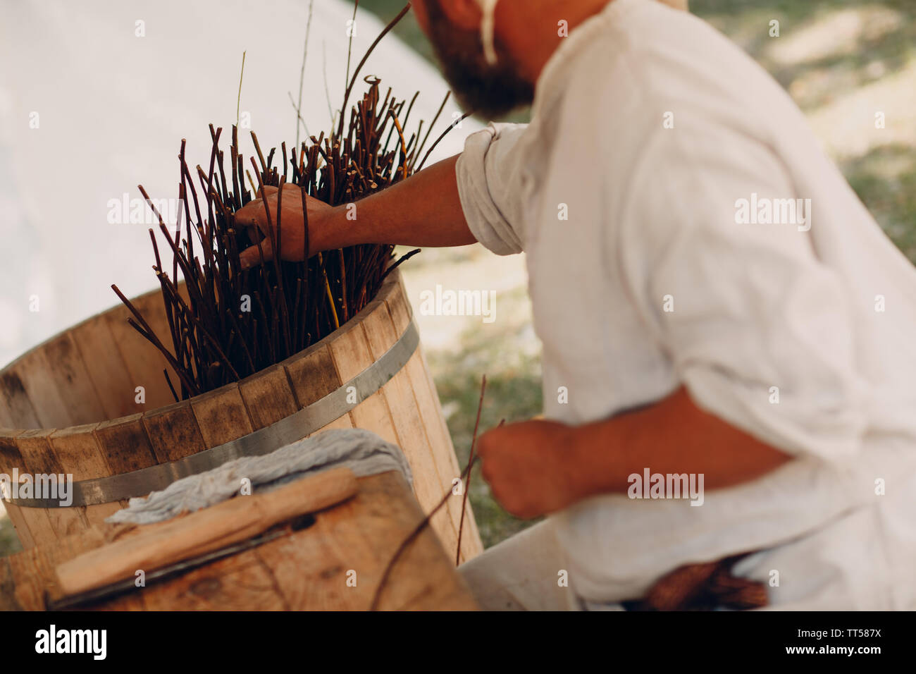 Master man weaves a basket of twigs Stock Photo - Alamy
