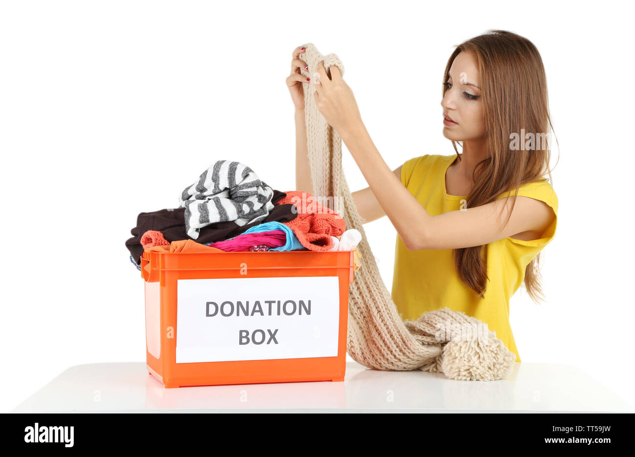 Girl volunteer with donation box isolated on white Stock Photo - Alamy
